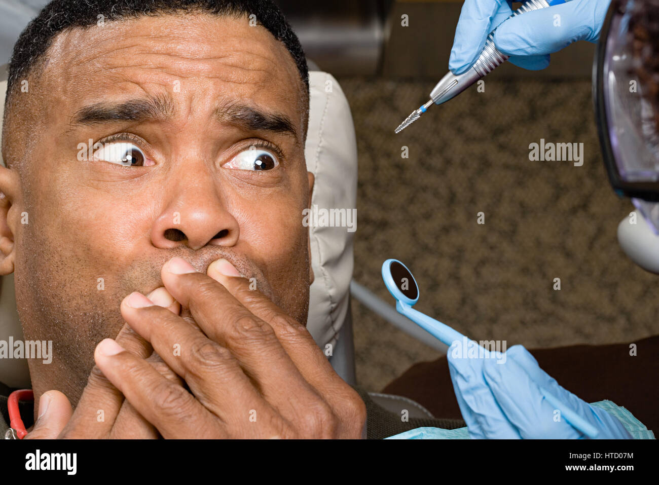 Man covering mouth Stock Photo - Alamy