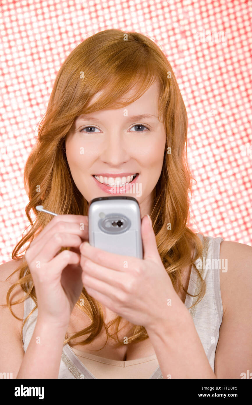 Woman using handheld computer Stock Photo - Alamy