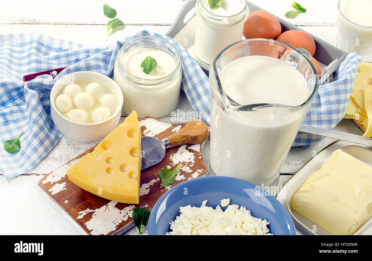 Dairy products on white wooden board. View from above Stock Photo - Alamy
