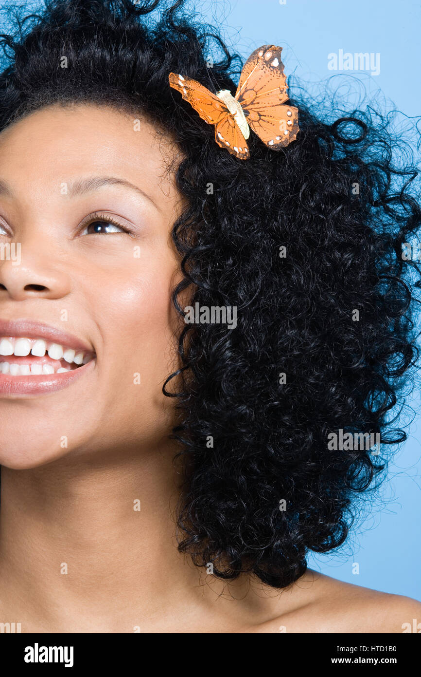 Woman with a butterfly in her hair Stock Photo - Alamy