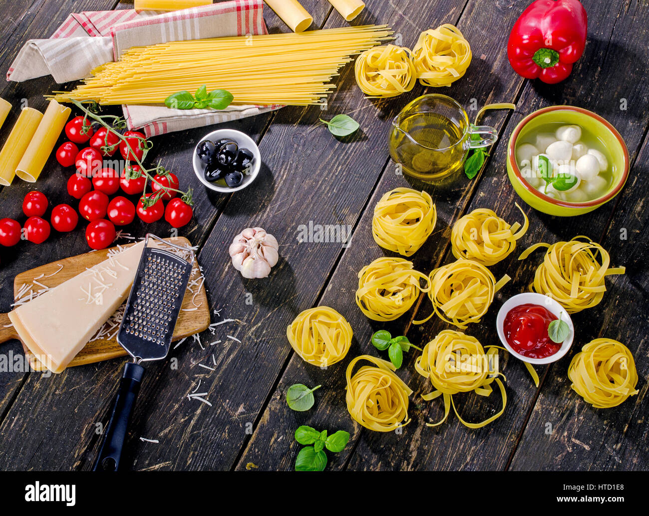 Italian food cooking ingredients on a wooden table. View from above ...