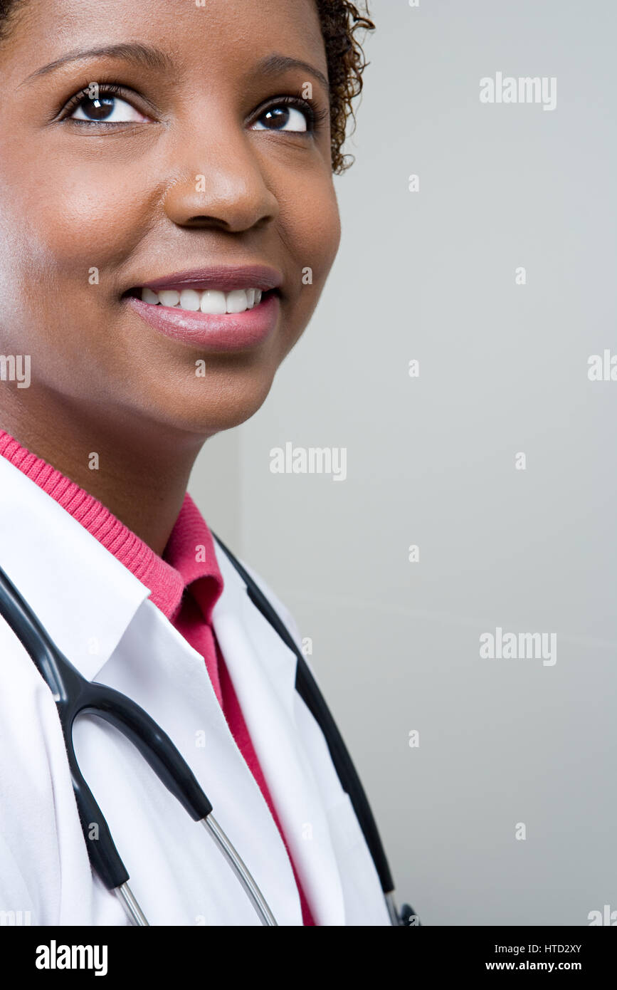Doctor looking up Stock Photo - Alamy