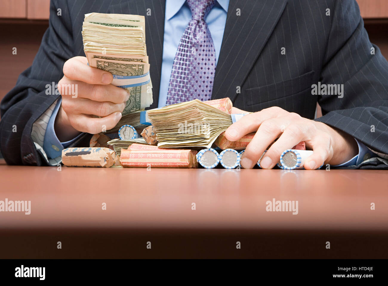 Businessman holding money Stock Photo - Alamy