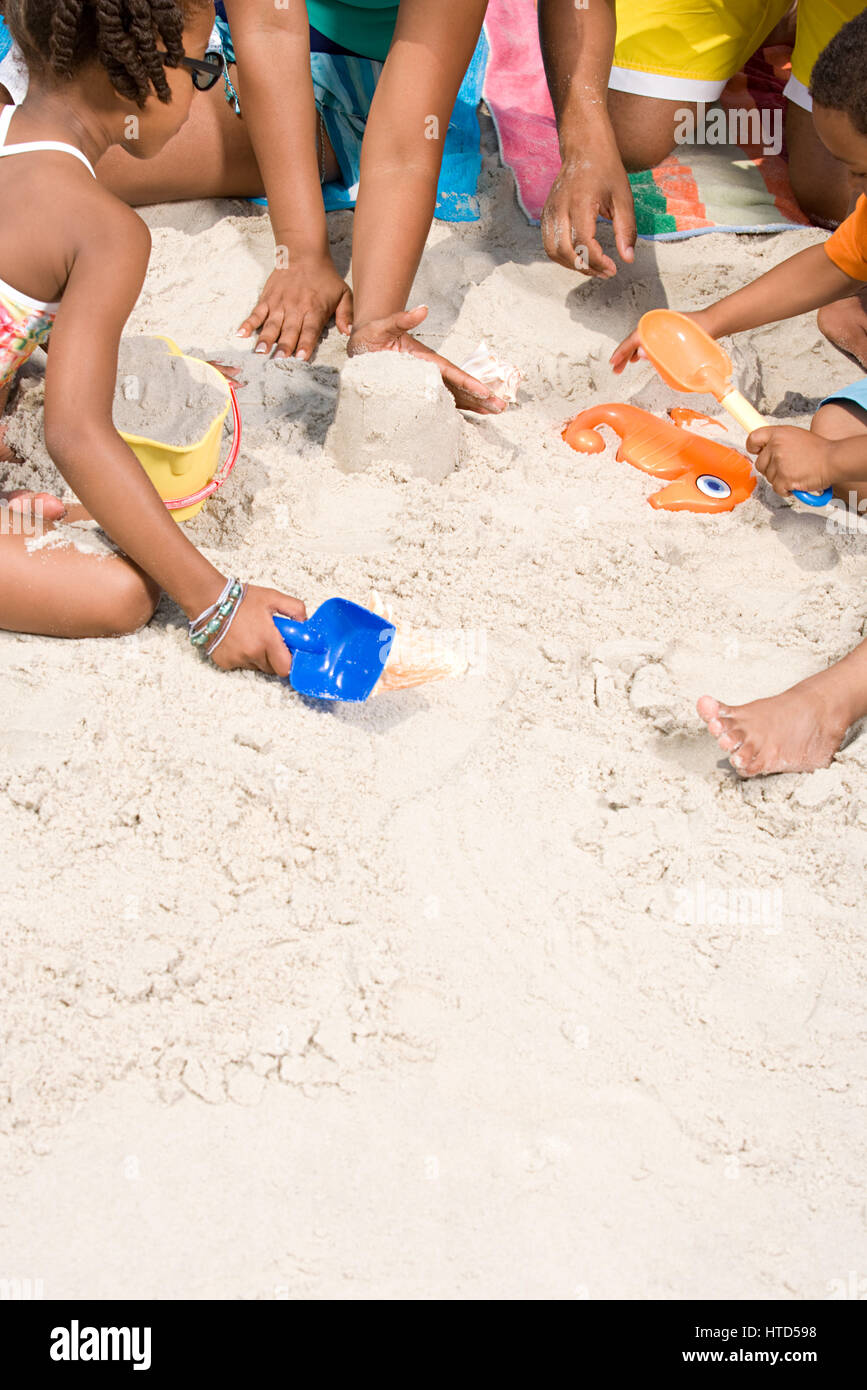 Boy making sandcastles hi-res stock photography and images - Alamy