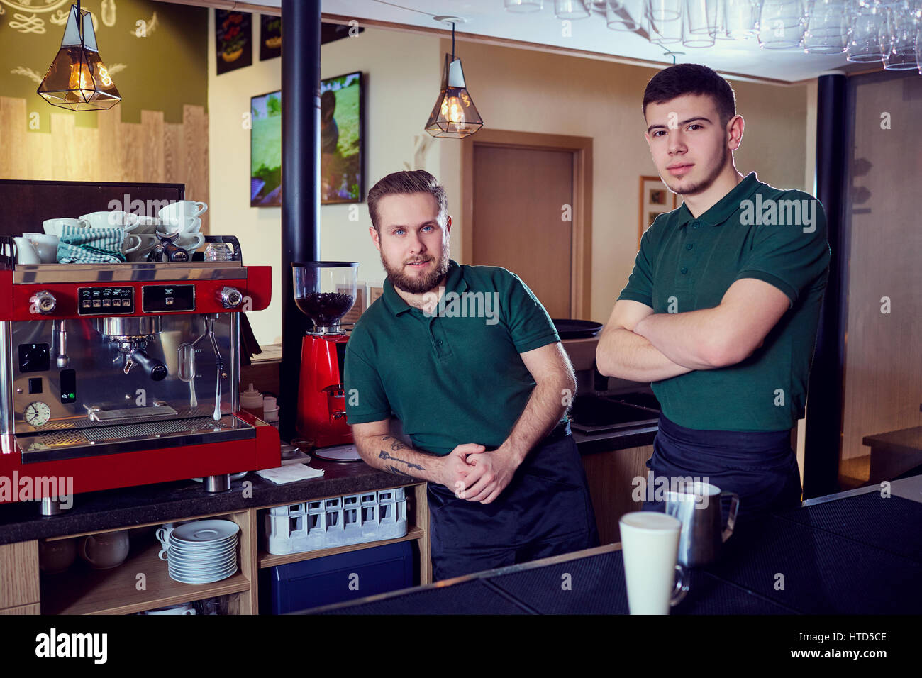 Two guys bartender barista waiter behind the bar in workplace Stock ...