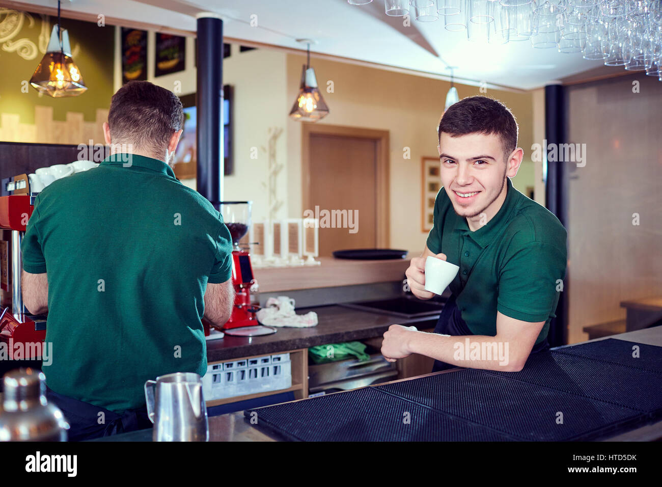 Two guys bartender barista waiter behind the bar in workplace Stock ...