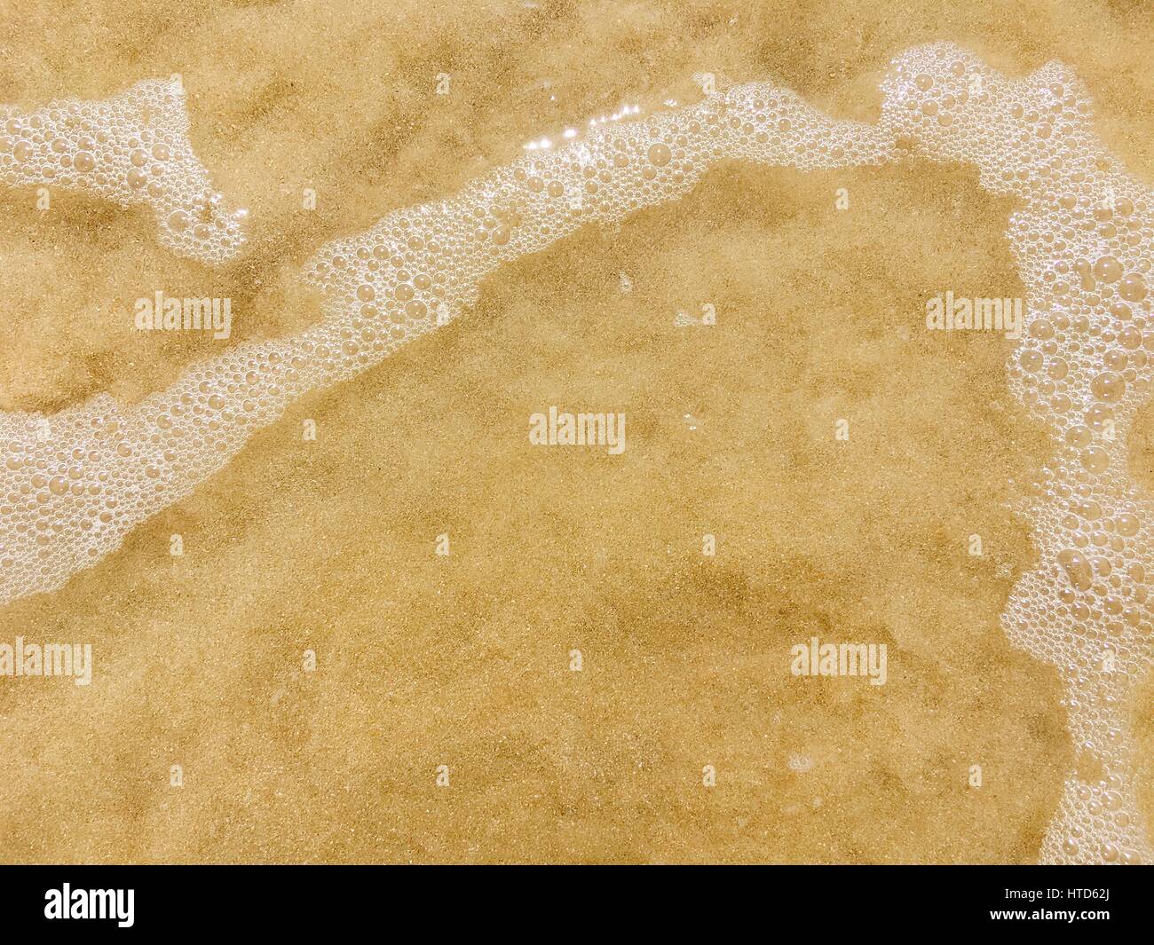 Sea waves reaching lapping to shore Stock Photo - Alamy