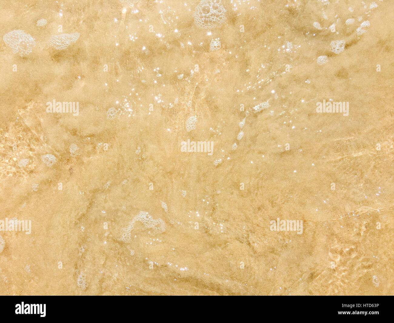Sea waves reaching lapping to shore Stock Photo - Alamy