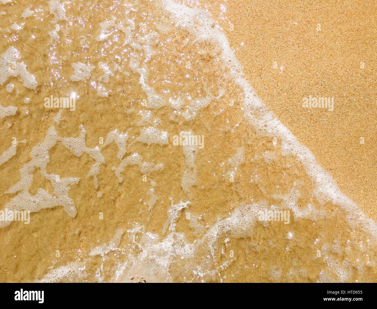 Sea waves reaching lapping to shore Stock Photo - Alamy