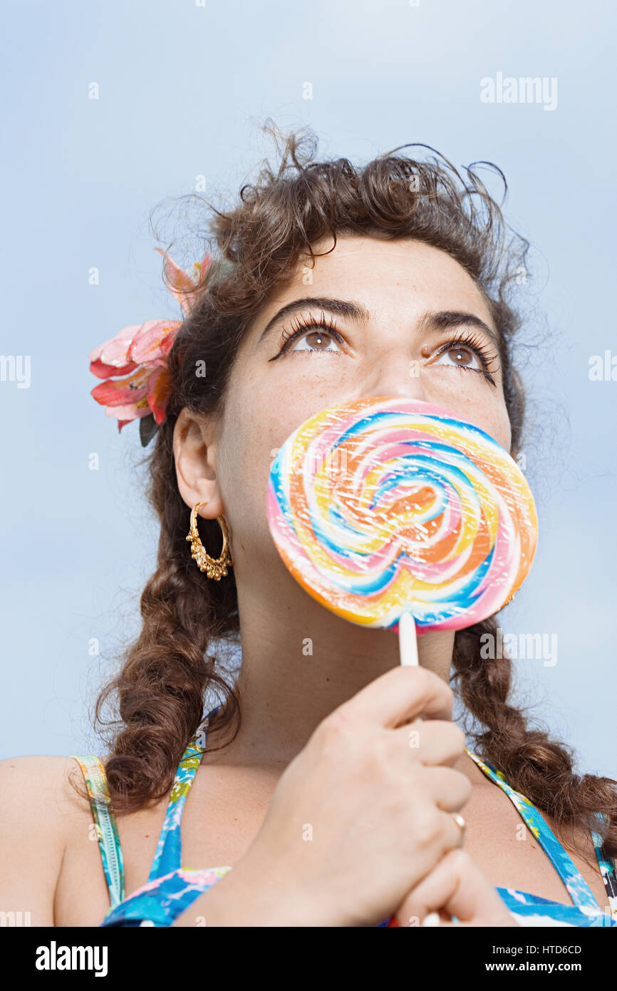 Woman with a lollipop Stock Photo - Alamy