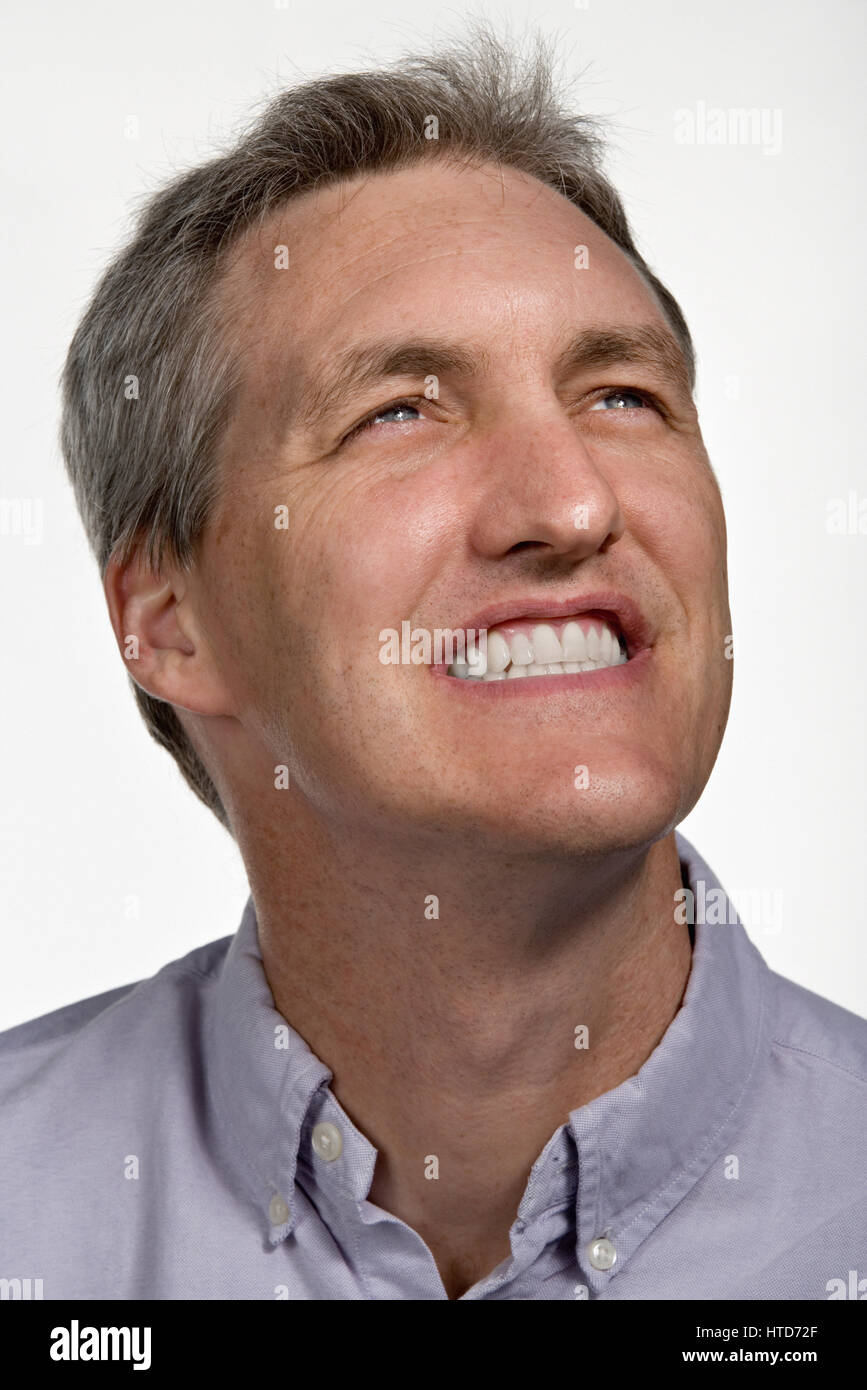 Happy macho mature man thinking hi-res stock photography and images - Alamy