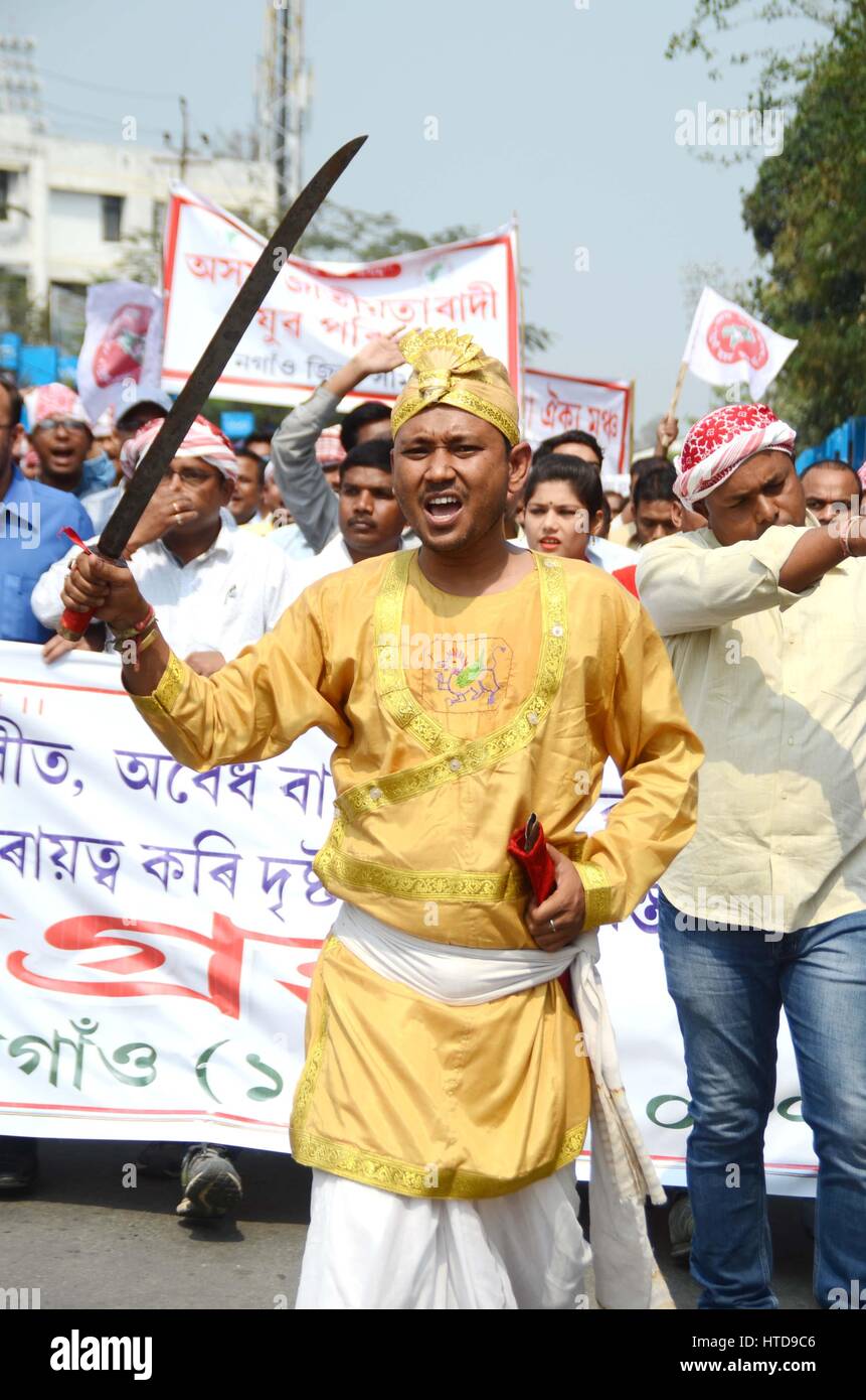 Nagaon, Assam. 10th Mar, 2017. A member of of AASU in traditional ...