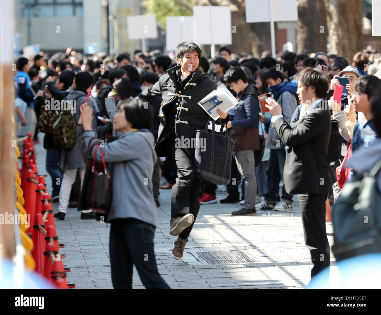 Tokyo, Japan. 10th Mar, 2017. A student leaps in the air in a ...