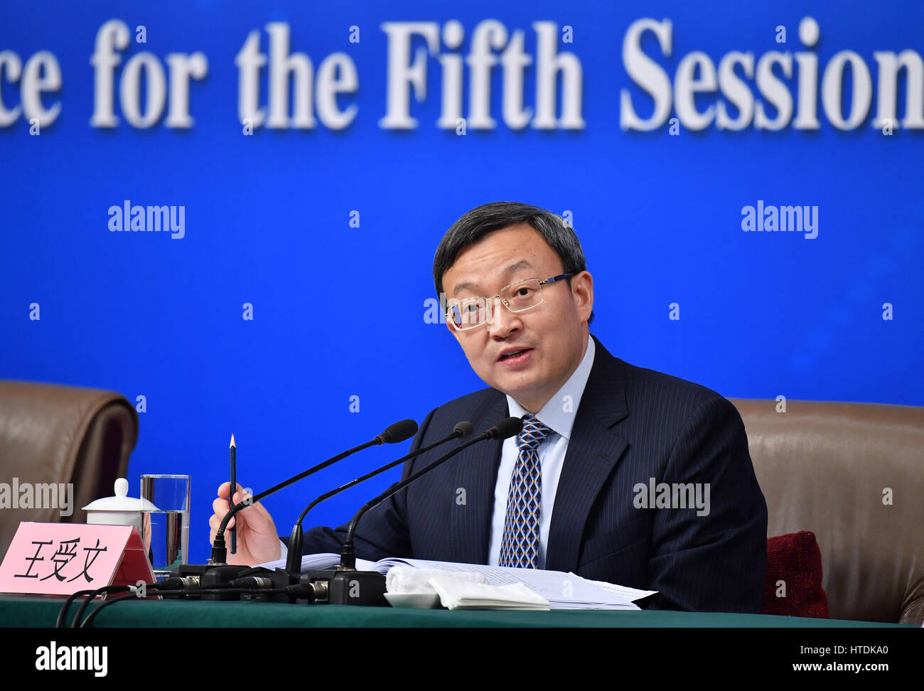 Beijing, China. 11th Mar, 2017. Chinese Vice Minister of Commerce Wang Shouwen answers questions ...