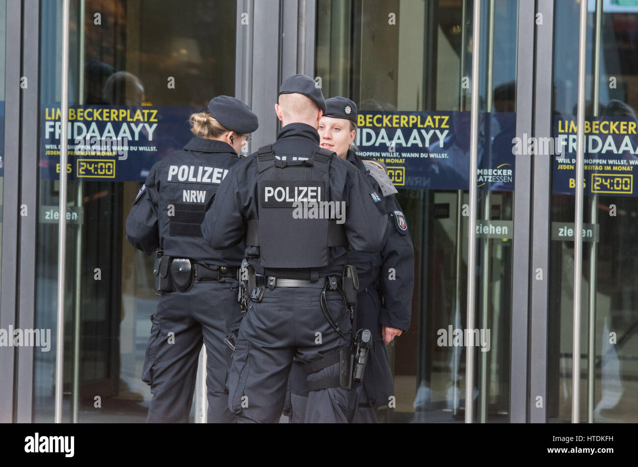 Essen, Germany. 11th Mar, 2017. Members of the German police secure the ...