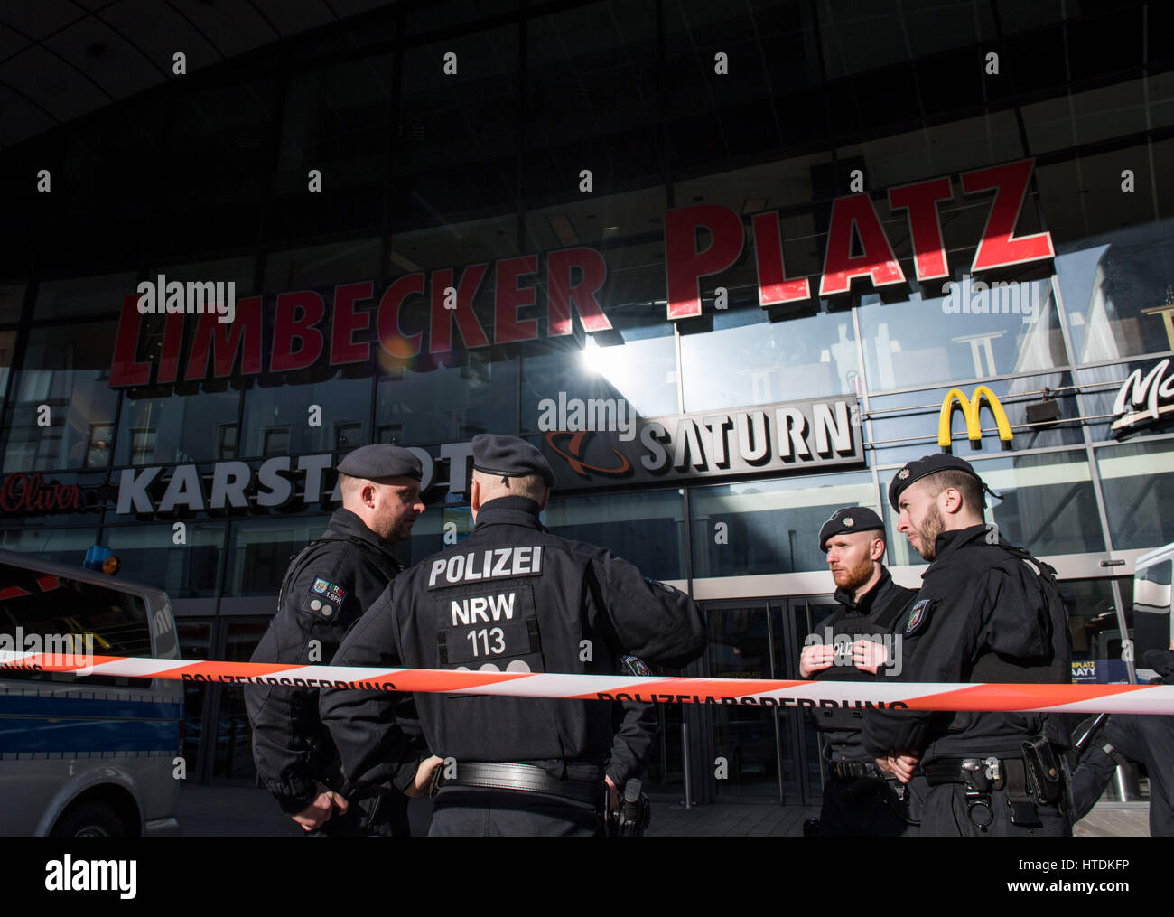 Essen, Germany. 11th Mar, 2017. Members of the German police secure the ...