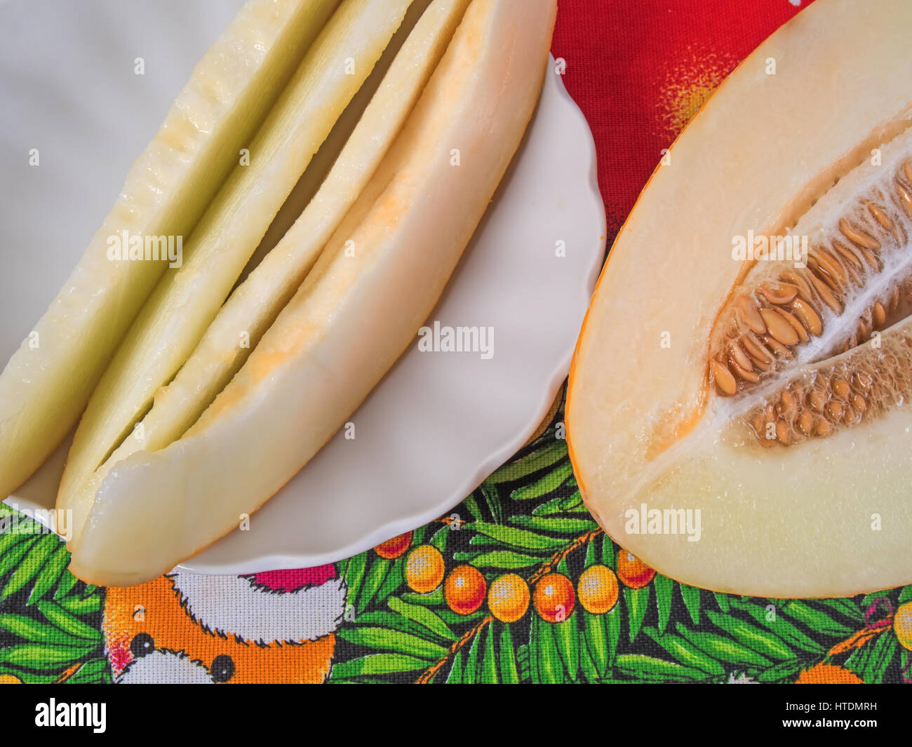 plate with a few slices of ripe melon Stock Photo - Alamy