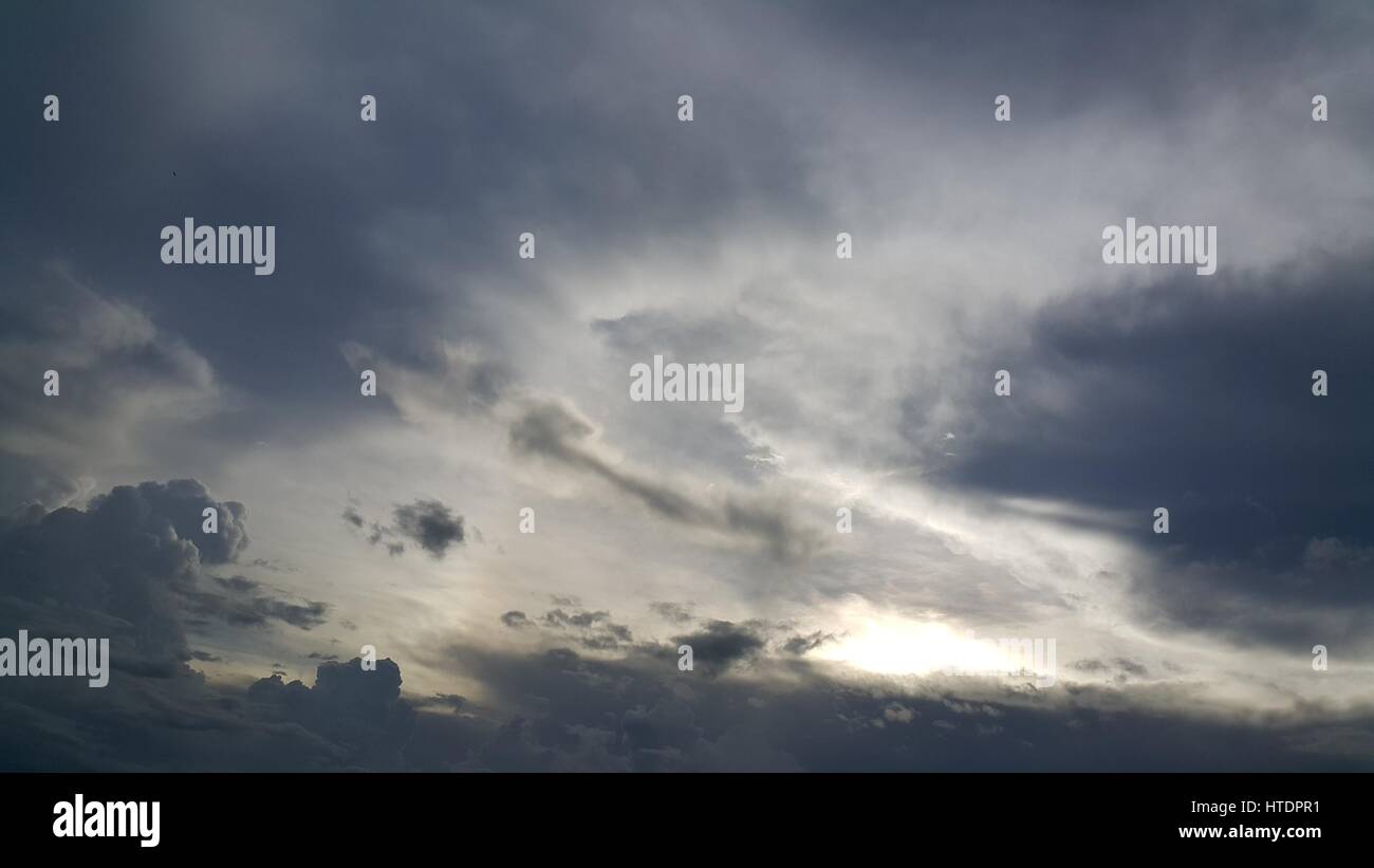 Cloudy sky with sun ray Stock Photo - Alamy