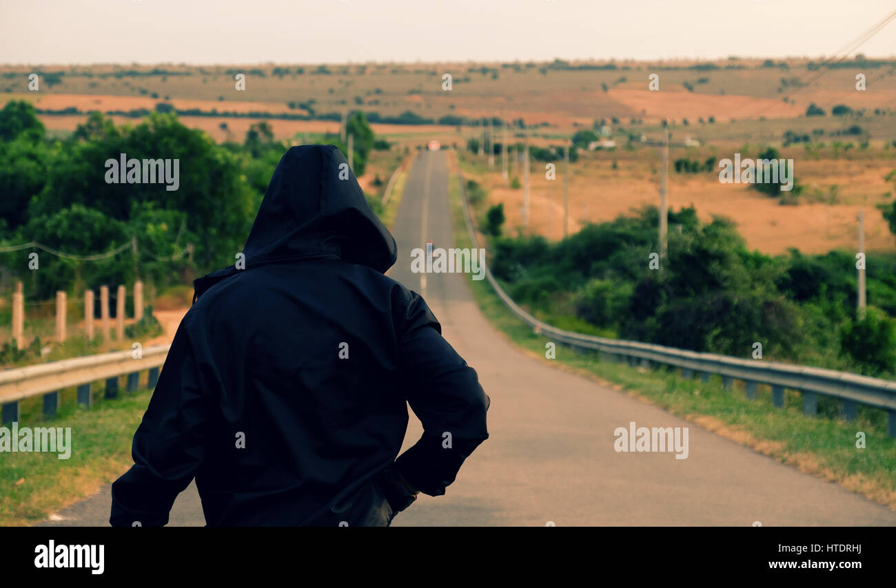 Asian man stand on the way and look forward to face with his choice ...