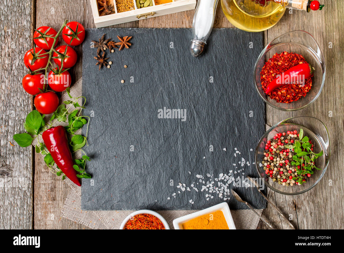 Food background, with space for text, herbs, spices, olive oil, salt ...
