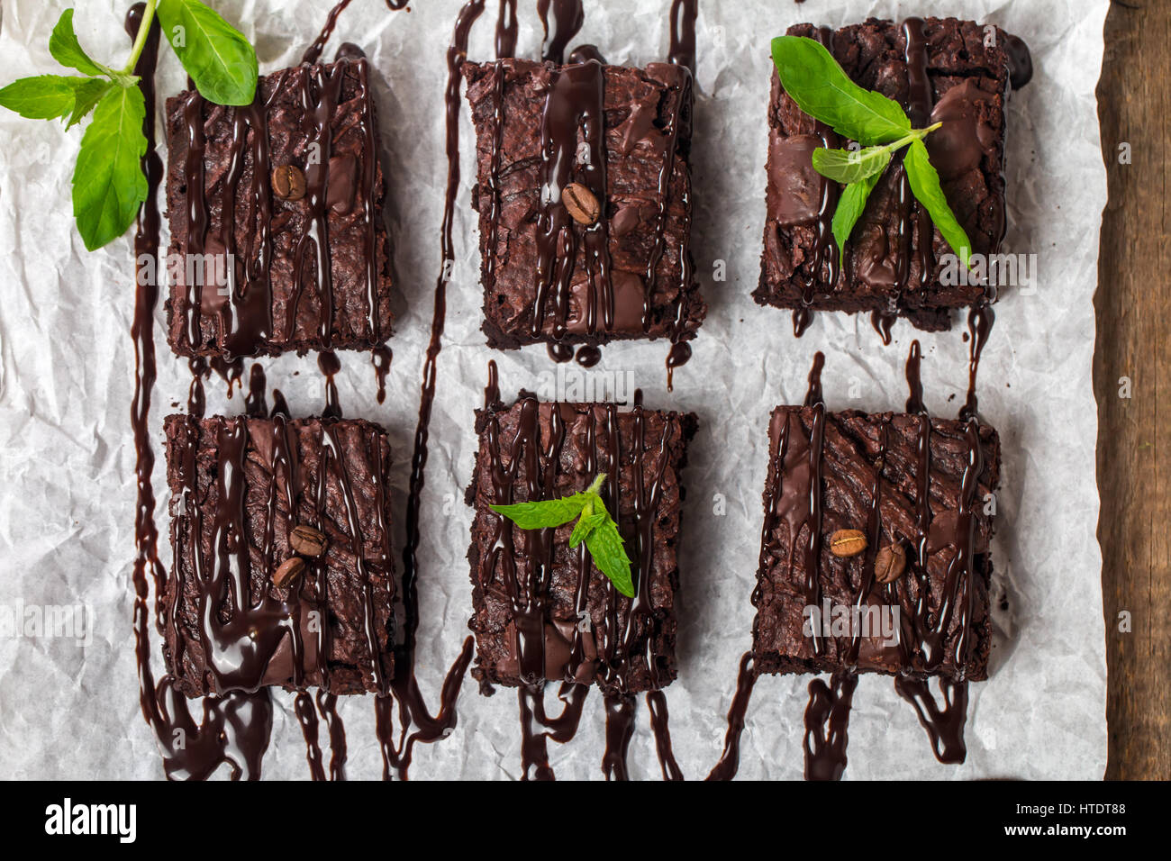 homemade chocolate brownies on white paper, top view Stock Photo - Alamy