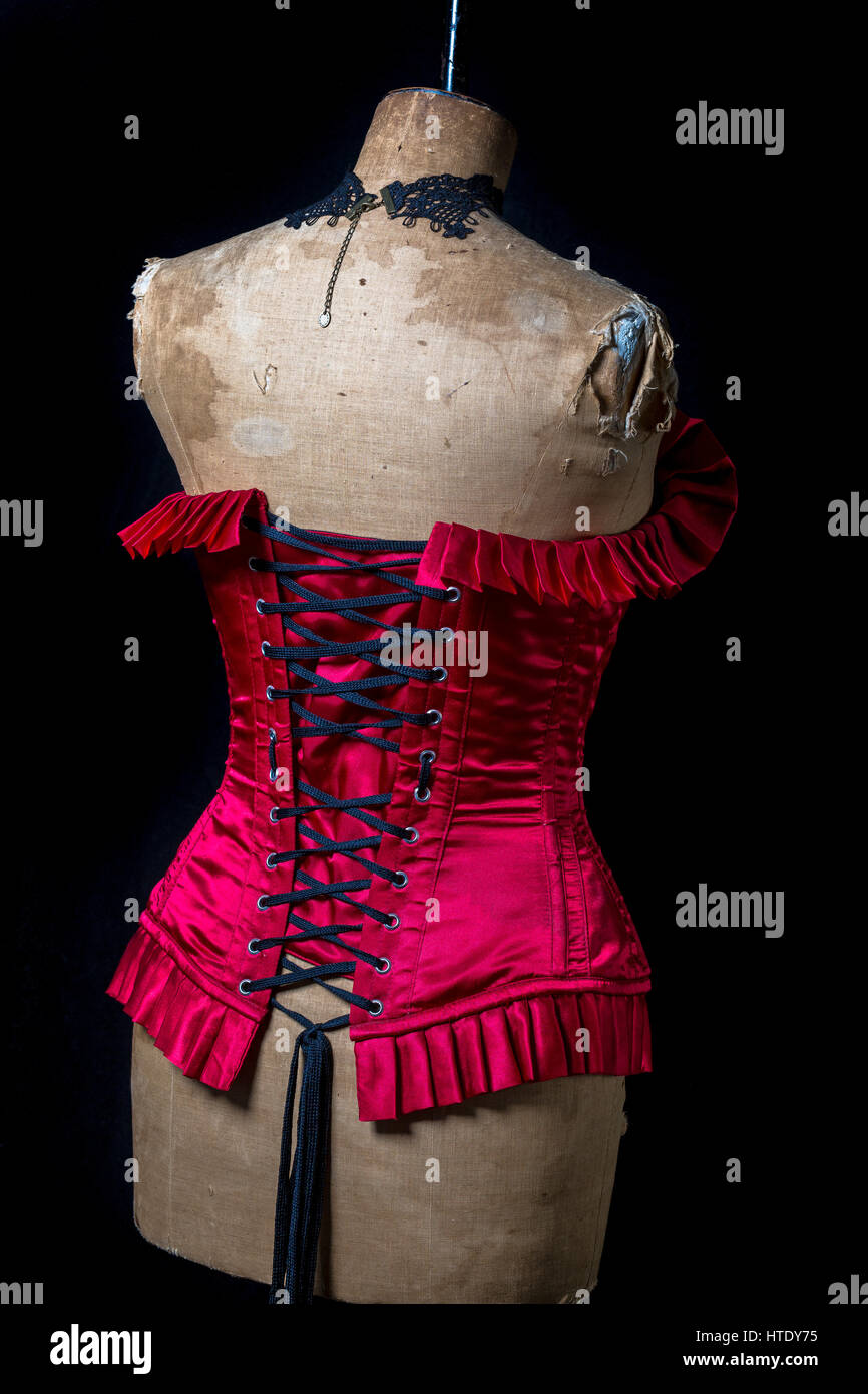 Red silk basque on a vintage mannequin Stock Photo - Alamy