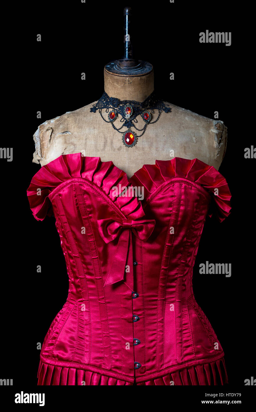 Red silk basque on a vintage mannequin Stock Photo - Alamy
