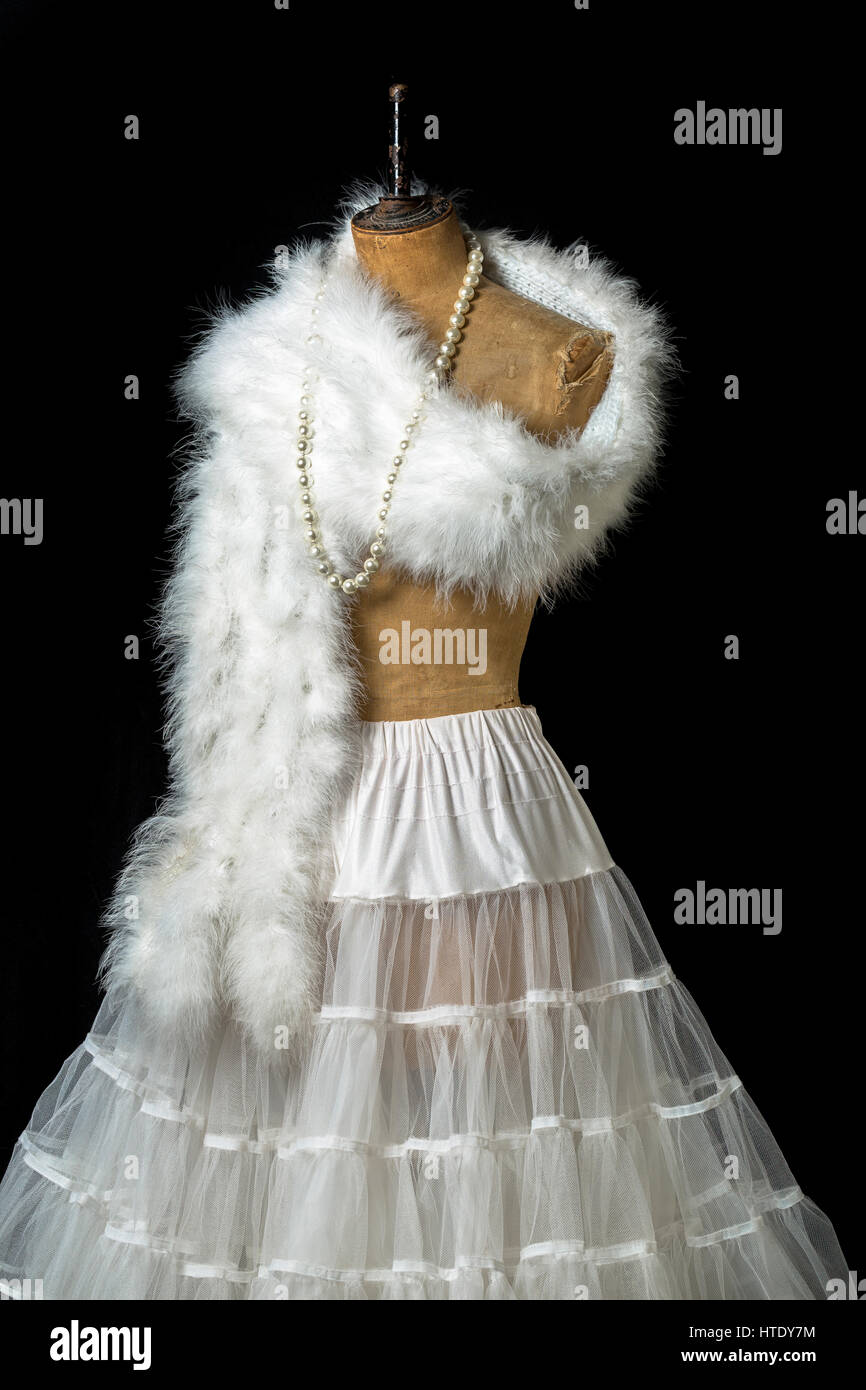 Red fur wrap and white net skirt on a mannequin Stock Photo - Alamy
