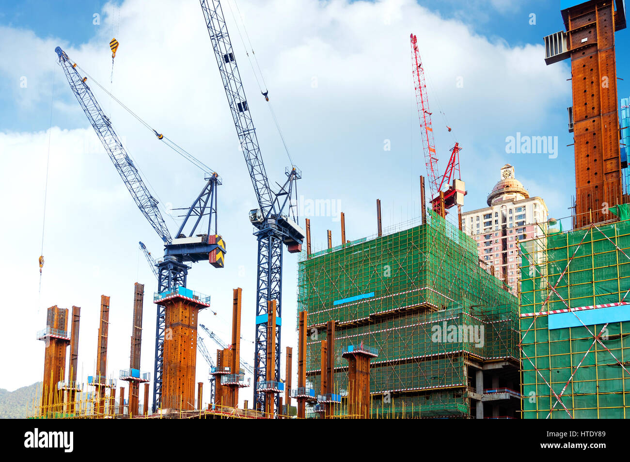 Blue sky background in the construction site and many cranes Stock ...