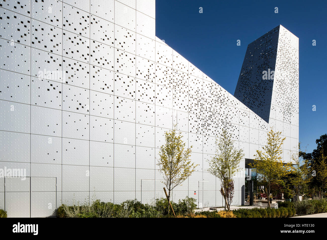 Angular roofline of exterior facade with perforated aluminium sheets ...