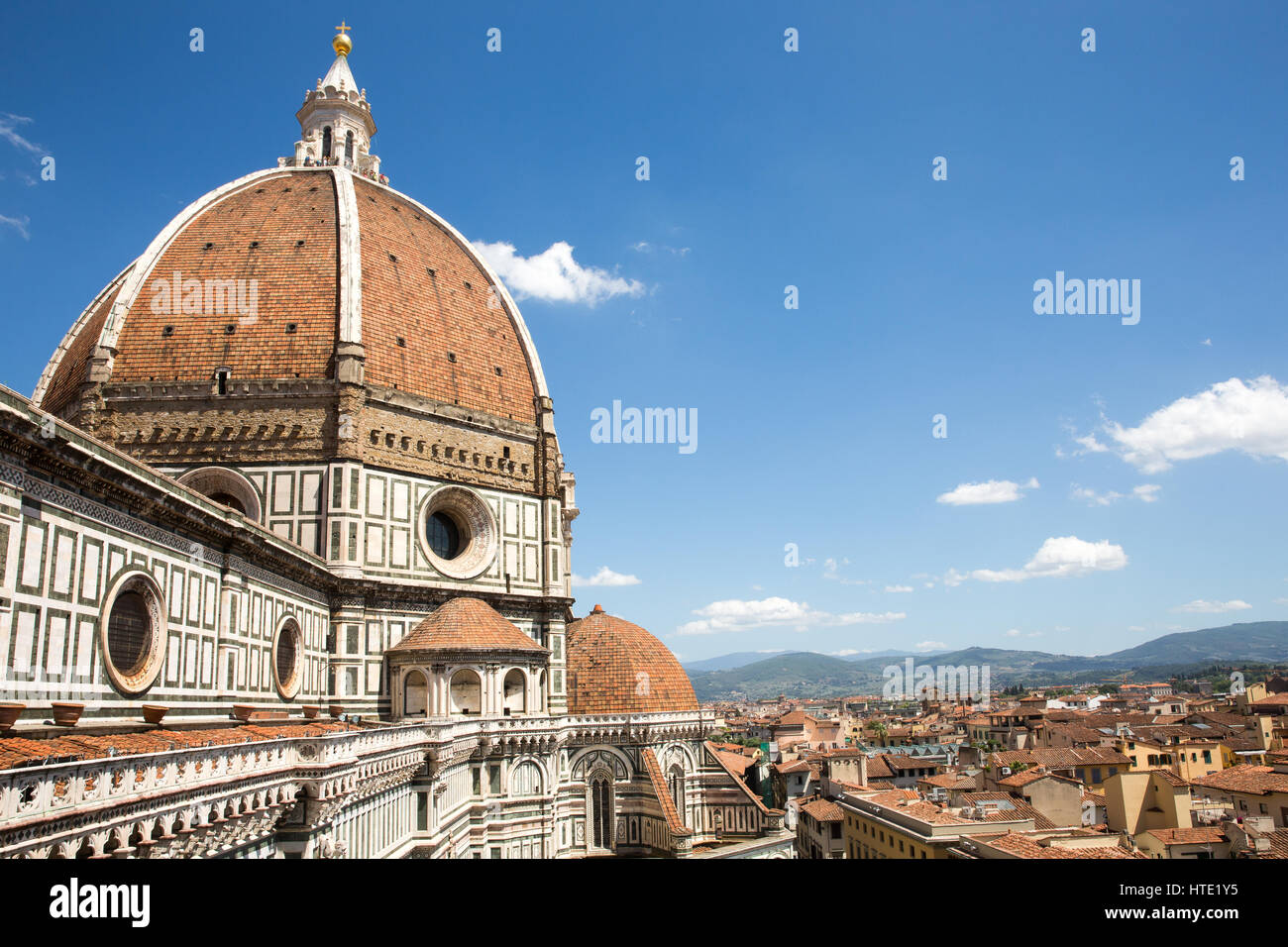 Dramatic view of the marble facade and dome of the Cathedral of ...