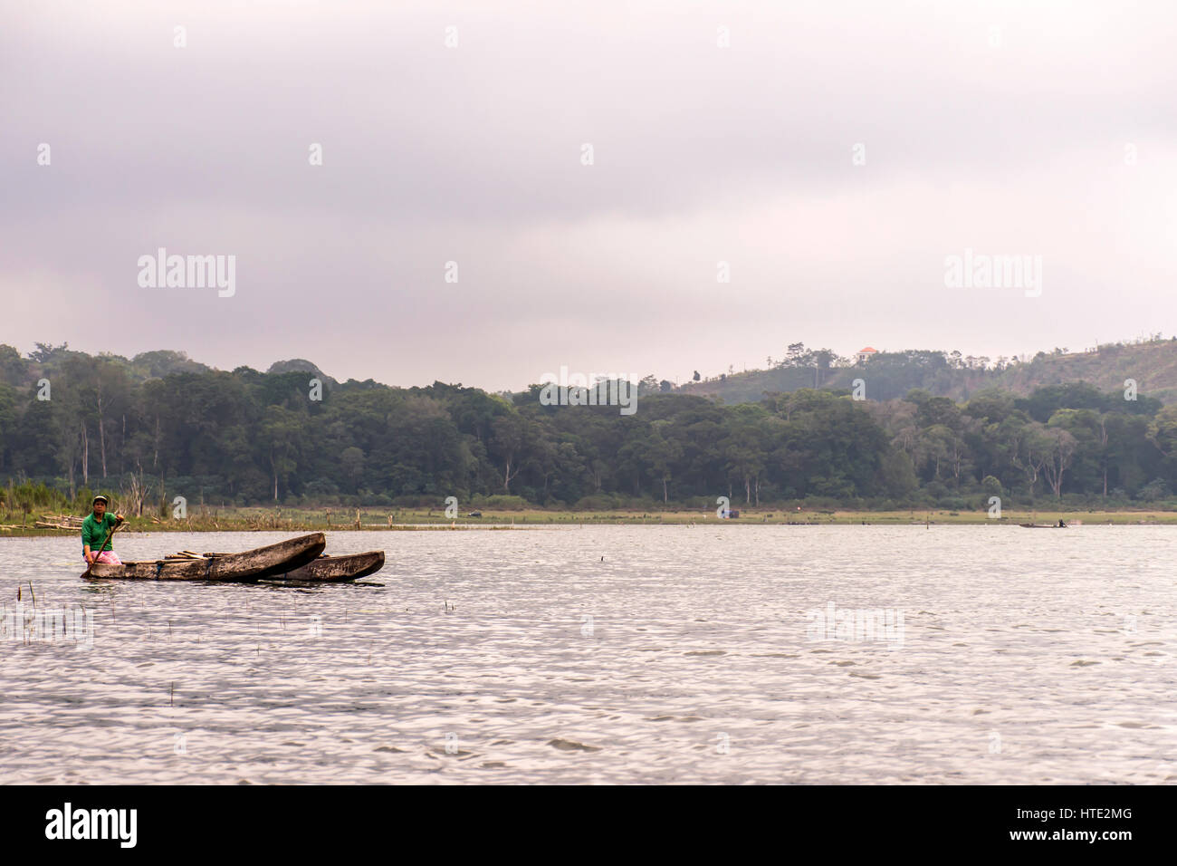 Indonesia Bali 10.10.2015 kanu boat with local people at Jungle by lake ...