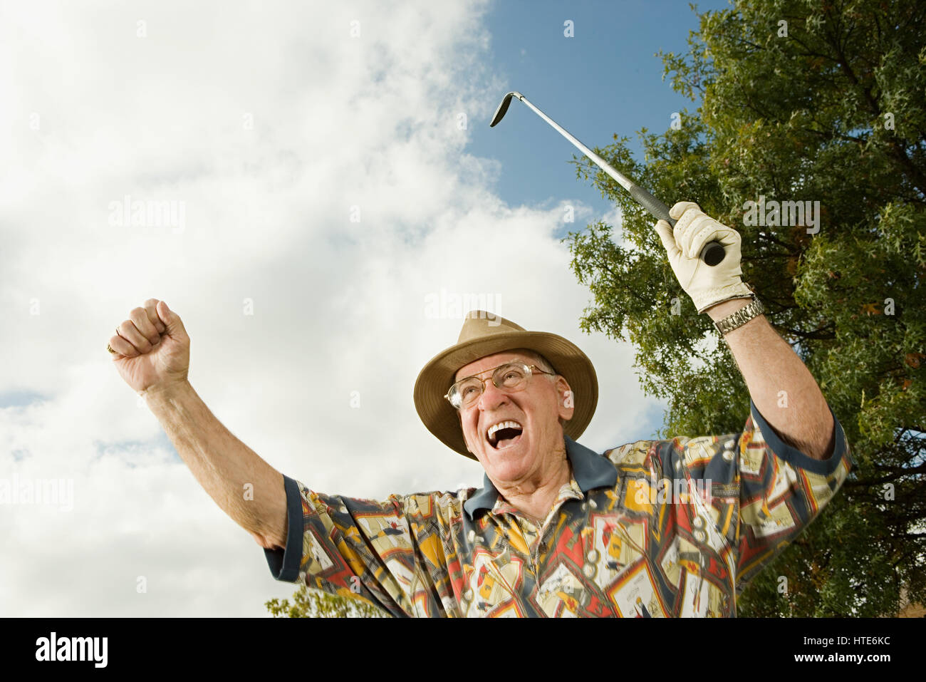 Senior man playing golf Stock Photo - Alamy