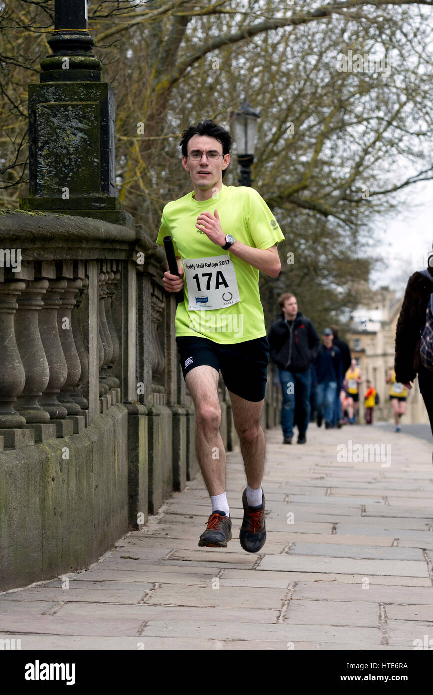 A runner crossing Magdalen Bridge in the Teddy Hall Relays, Oxford, UK ...