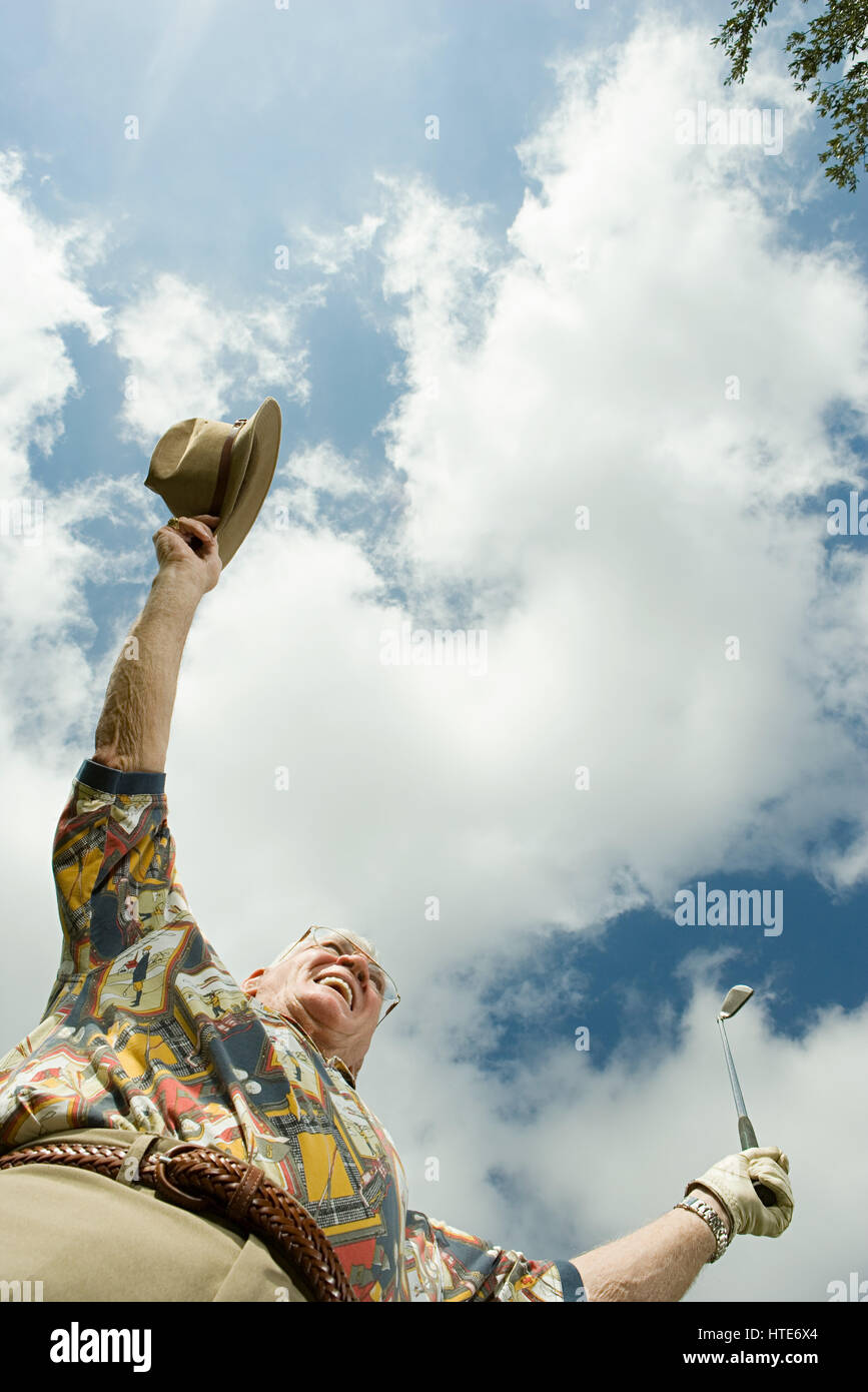Senior man playing golf Stock Photo - Alamy