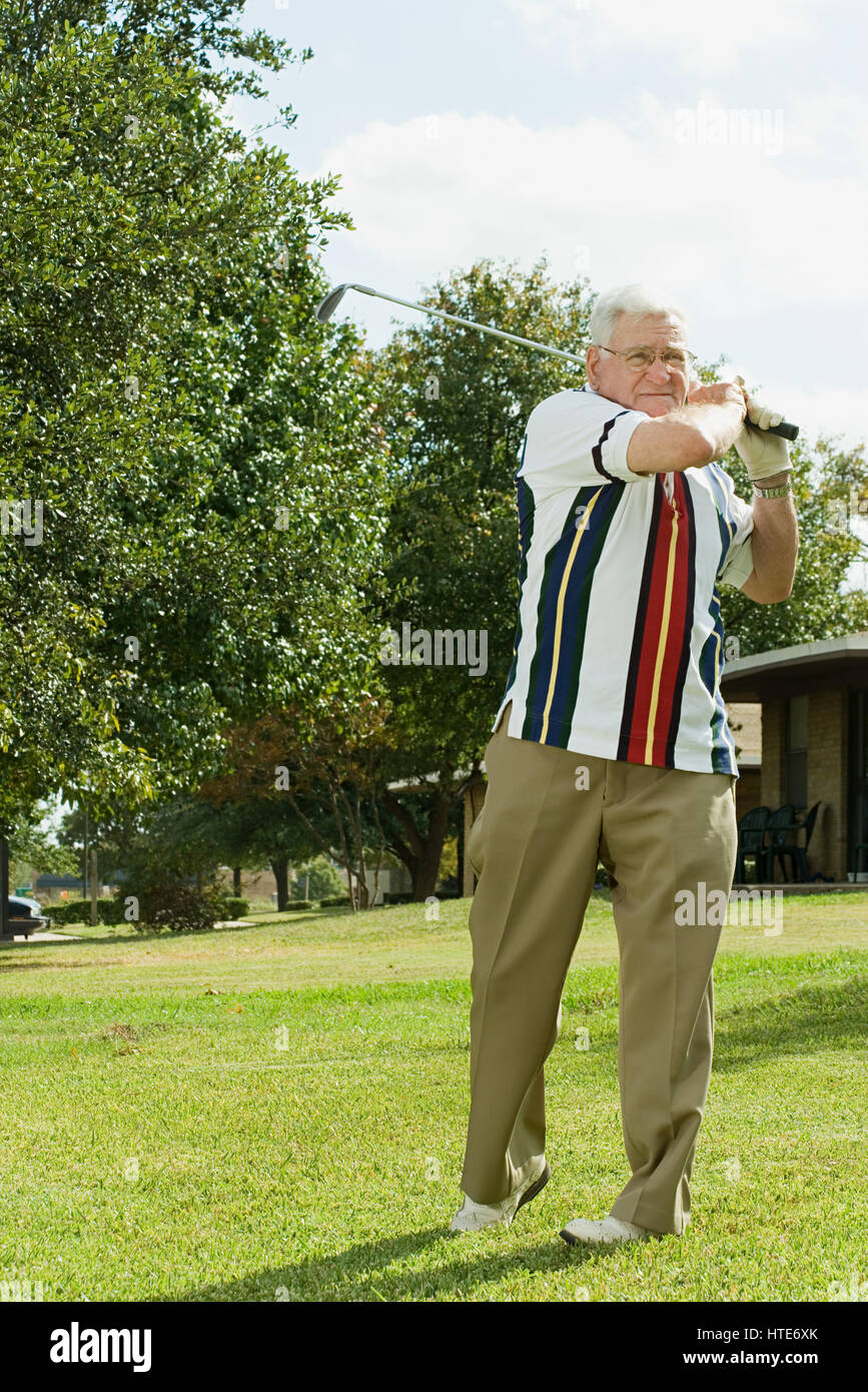 Senior man playing golf Stock Photo - Alamy