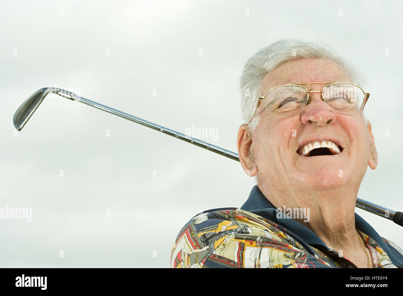 Senior man playing golf Stock Photo - Alamy
