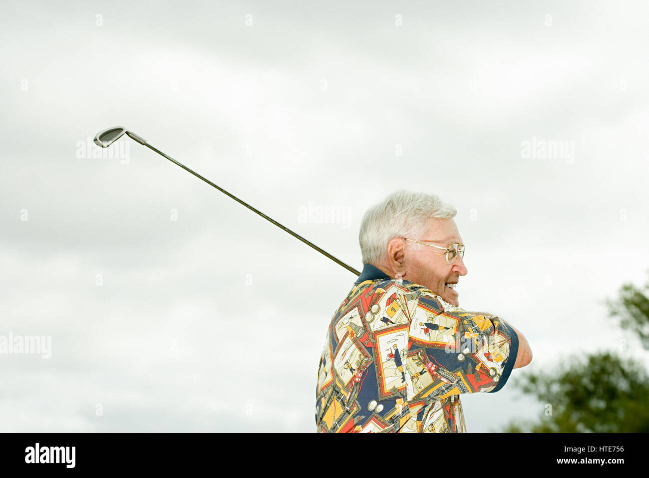Senior man playing golf Stock Photo - Alamy