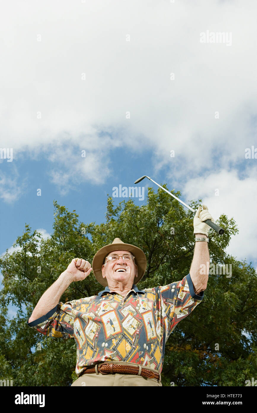 Senior man playing golf Stock Photo - Alamy