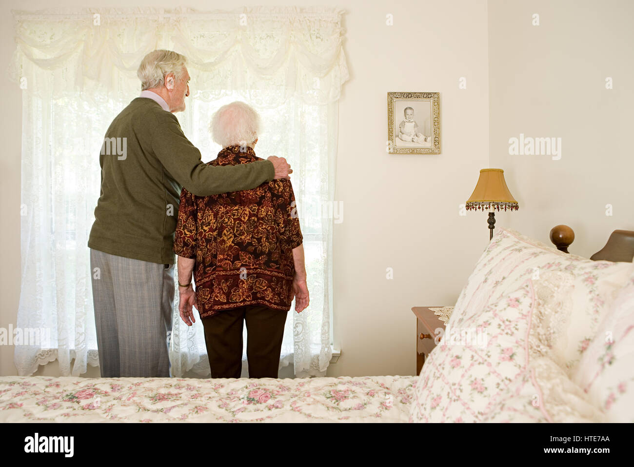 Elderly couple in their bedroom Stock Photo - Alamy