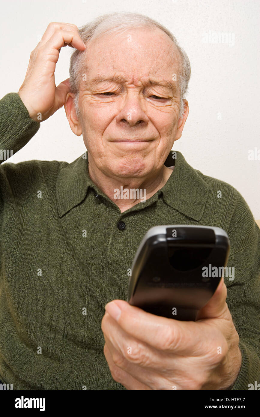 Confused elderly man with remote control Stock Photo - Alamy Confused elderly man with remote control Stock Photo - Alamy