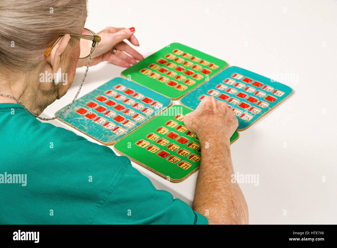 Senior woman playing bingo Stock Photo - Alamy