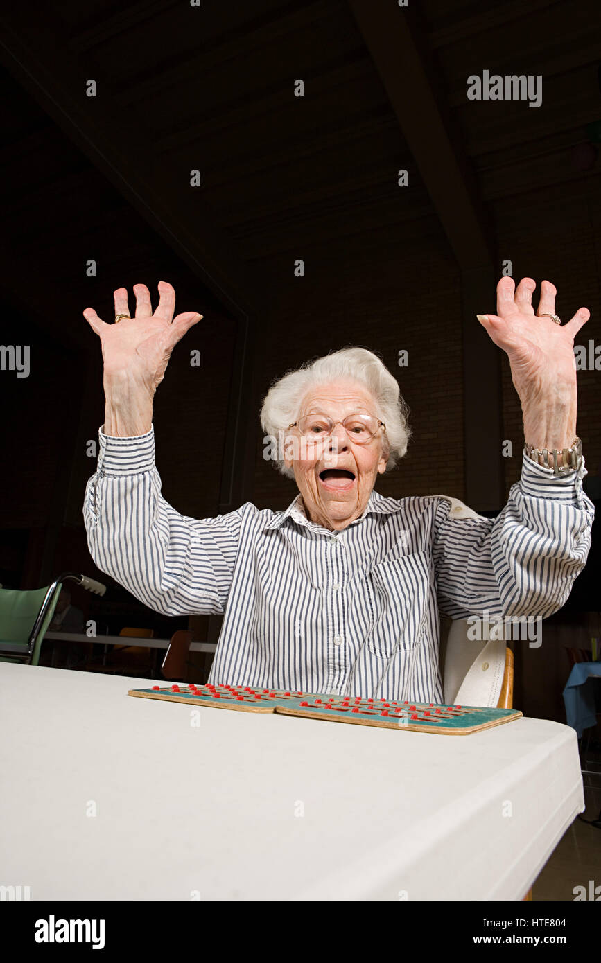 Senior woman playing bingo Stock Photo - Alamy