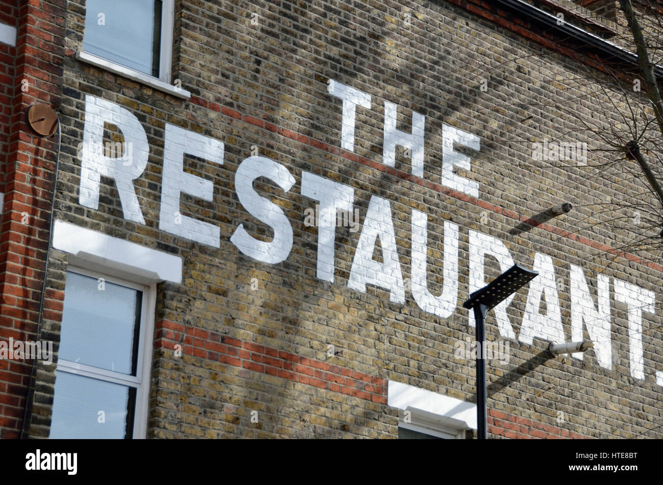 Generic ’The Restaurant’ sign on the outside wall of a building Stock ...