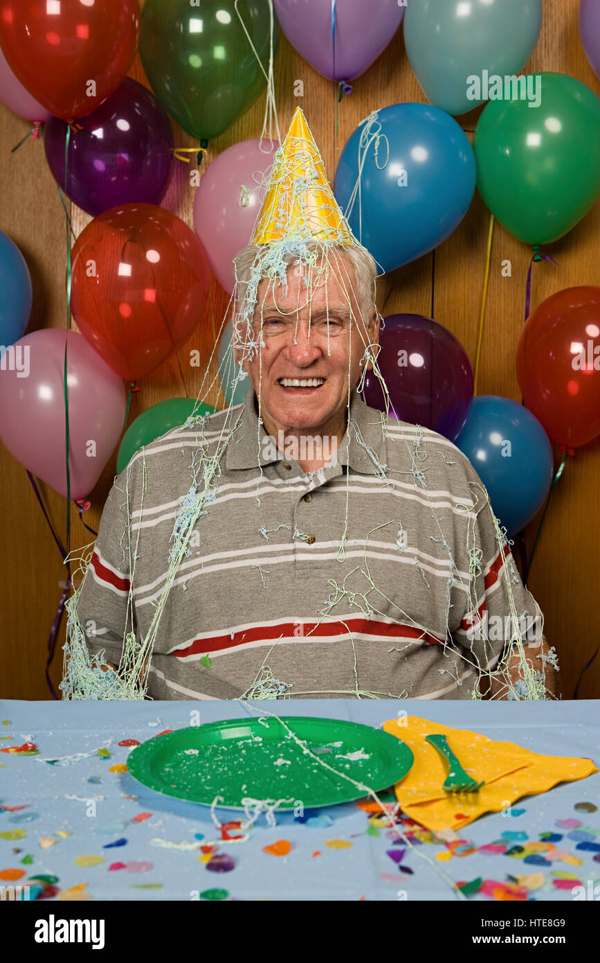 Senior man at a party Stock Photo - Alamy