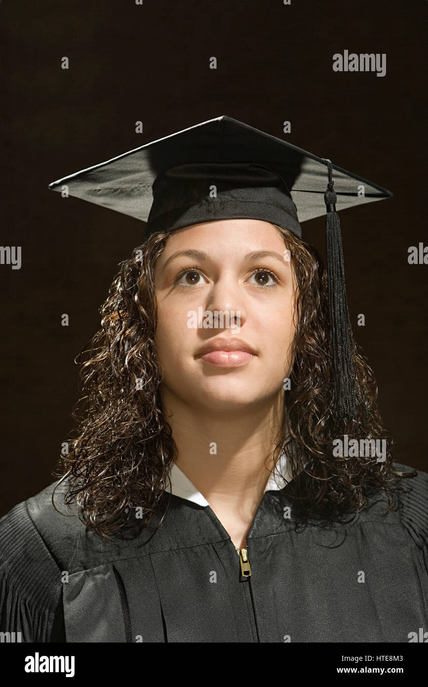 Female graduate looking up Stock Photo - Alamy