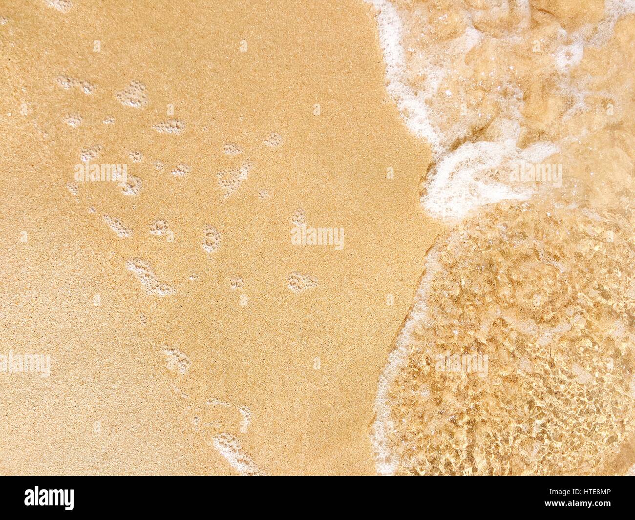 Sea waves reaching lapping to shore Stock Photo - Alamy