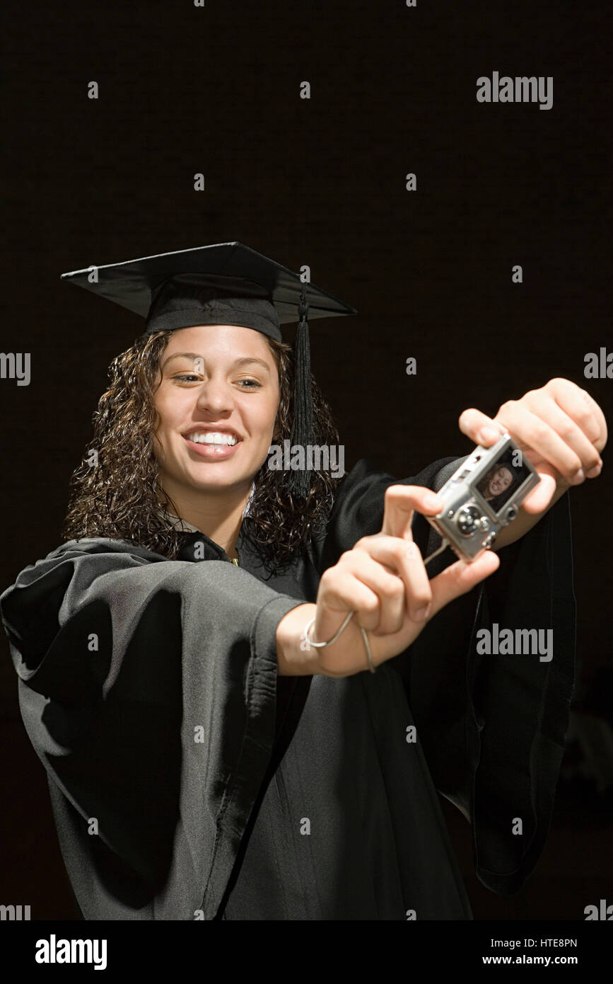 Female graduate taking a self portrait Stock Photo - Alamy