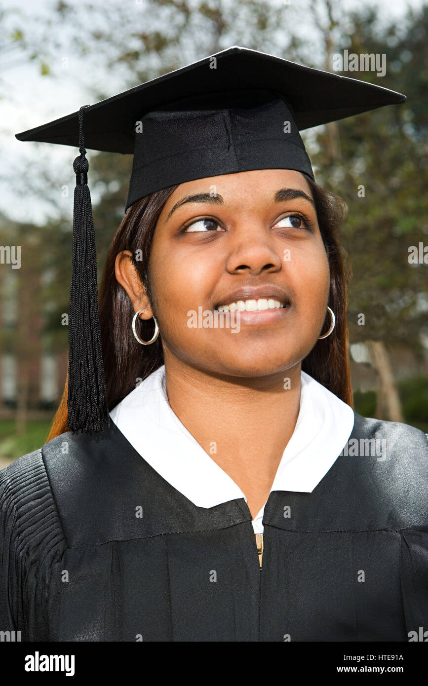 Female graduate looking up Stock Photo - Alamy