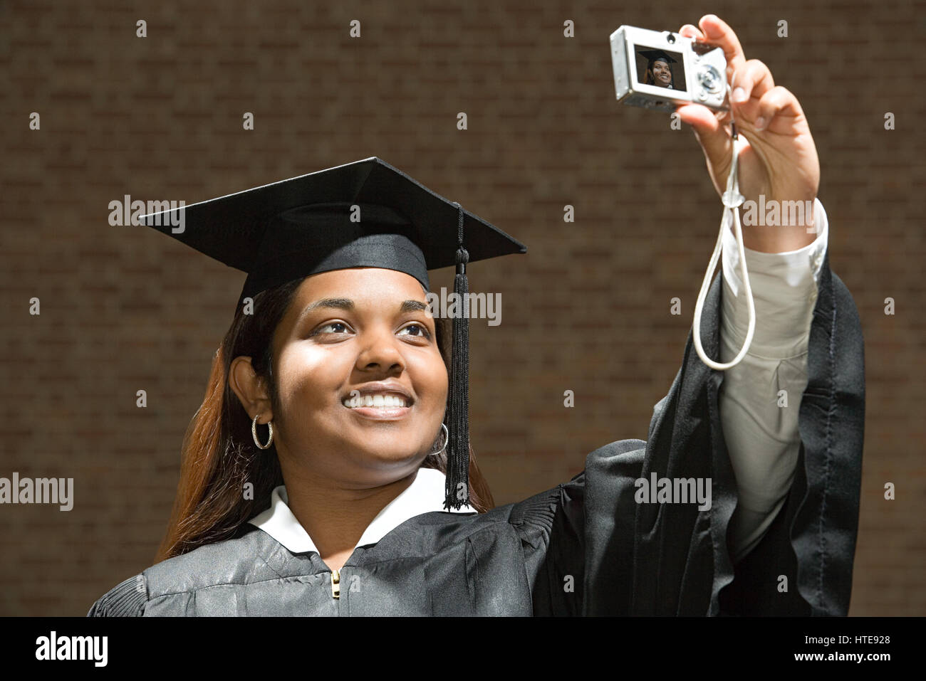 Female graduate taking a self portrait Stock Photo - Alamy
